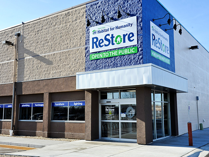 The blue corner entrance of ReStore stands like a beacon of bargain hope, promising treasures inside that won't empty your wallet.