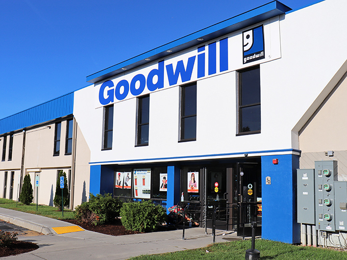 The iconic blue-and-white facade of Williston's Goodwill beckons bargain hunters like a retail lighthouse guiding ships to treasure-filled shores.