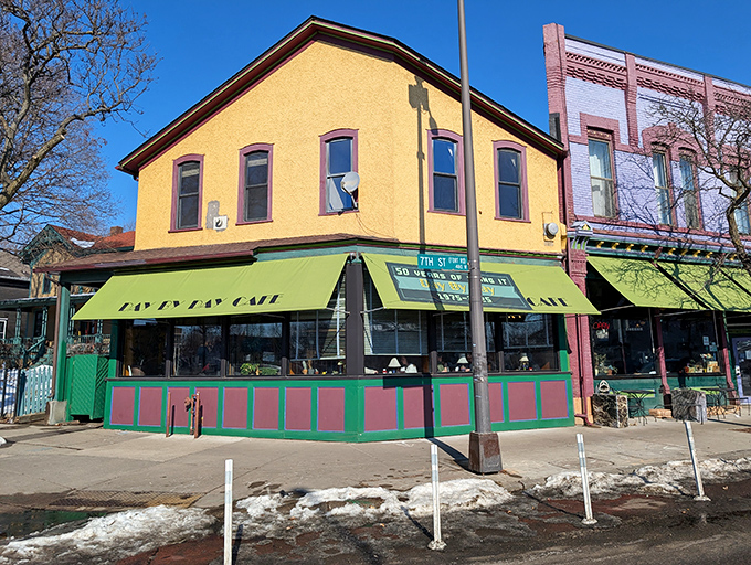 The bright yellow exterior with green awnings stands like a beacon of breakfast hope on this St. Paul corner, promising comfort food salvation within.
