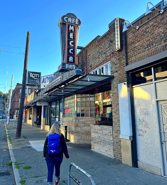 Walking toward the Mecca feels like stepping into a time capsule where affordable meals and authentic atmosphere have stubbornly refused to surrender to gentrification.