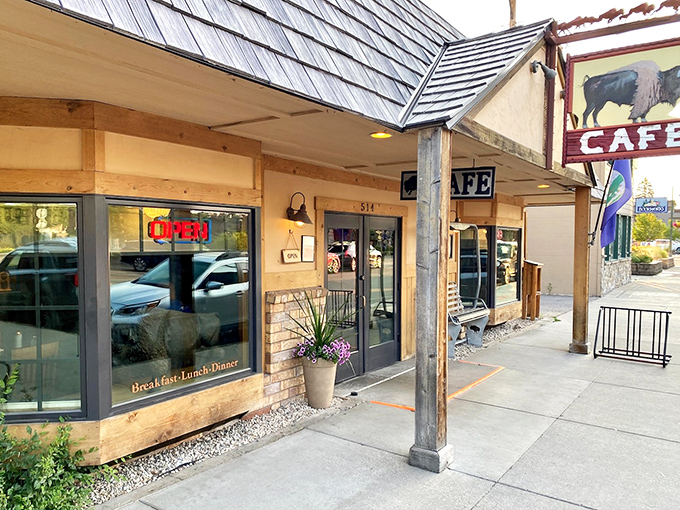 The iconic buffalo sign beckons hungry travelers like a breakfast lighthouse. This rustic wooden exterior with its weathered charm promises Montana hospitality inside.
