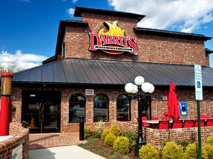 The brick fortress of flavor stands proud against Carolina blue skies, its red sign promising delicious adventures that have launched a thousand food pilgrimages.