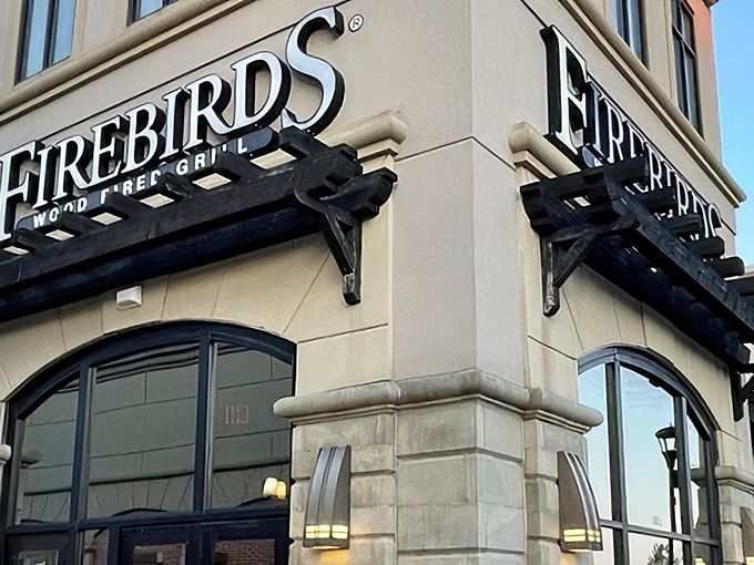 The iconic Firebirds exterior beckons like a warm hearth on a cold Pennsylvania evening. Stone and wood elements hint at the flame-kissed delights waiting inside.