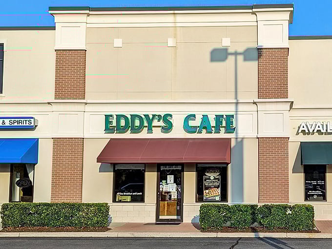 The emerald green sign of Eddy's Cafe beckons like a lighthouse for hungry souls navigating the strip mall seas of Virginia Beach.