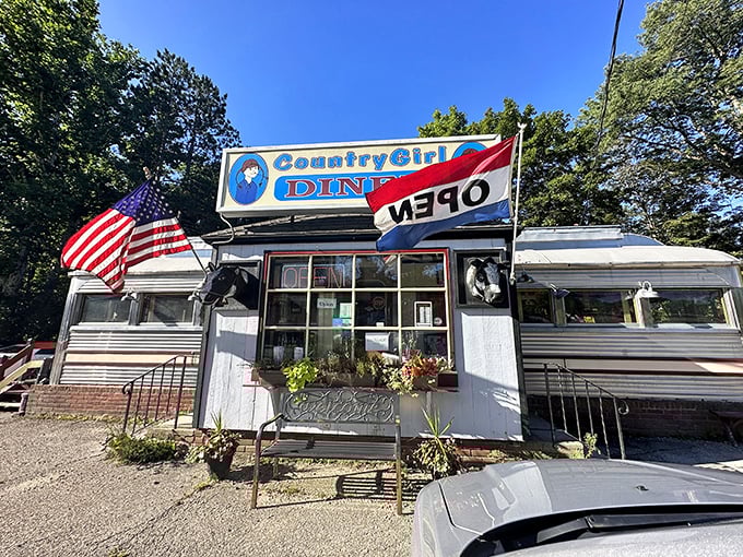 Summer sunshine gleams off the vintage exterior, where the "OPEN" flag waves like a beacon to hungry travelers.
