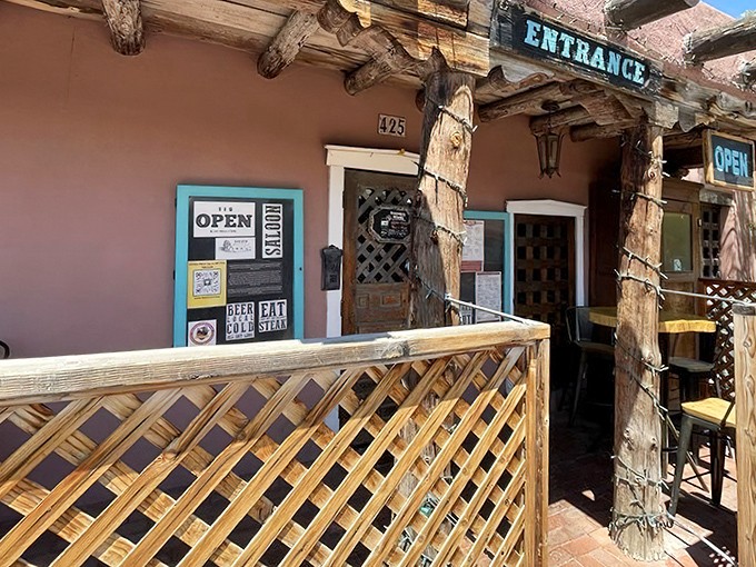 The pink adobe facade of High Noon beckons like a southwestern siren, promising culinary treasures behind that weathered wooden door.