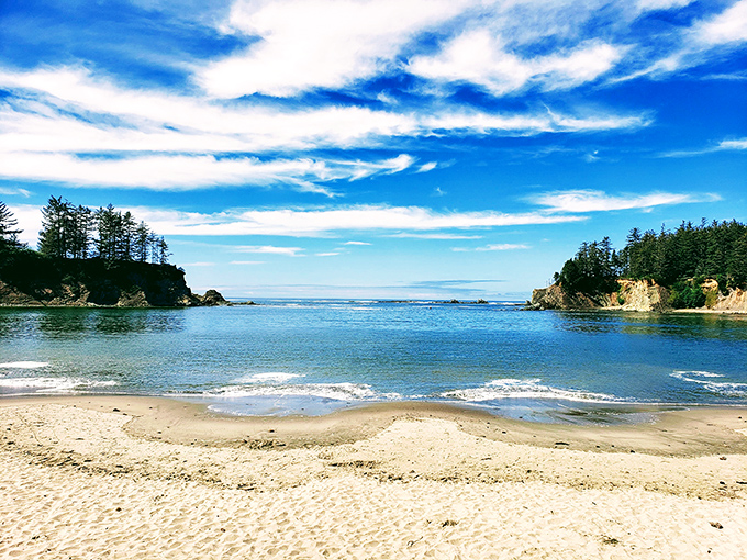 This protected cove proves that sometimes the best beaches come with their own natural security system.