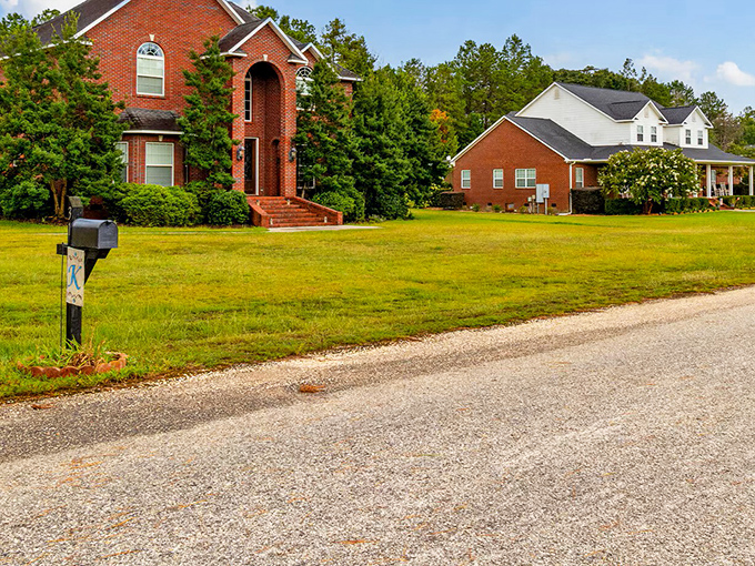 Stately brick homes showcase Monroeville's architectural diversity, where modern residences blend with the town's historic character in peaceful residential areas.