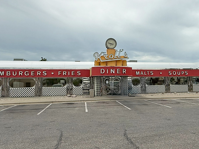 The gleaming chrome exterior of Kroll's Diner stands like a time machine to the 1950s, beckoning hungry travelers with promises of comfort food nirvana.
