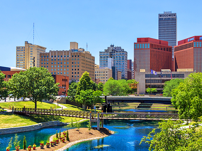 Omaha's Gene Leahy Mall shimmers like an urban oasis, where downtown architecture meets nature in a perfect Midwestern handshake. The vibrant blue waterway invites you to pause and appreciate city planning done right.