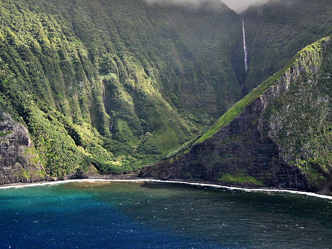 Nature's skyscrapers meet the sea along Molokaʻi's north shore, where waterfalls cascade down some of the world's tallest sea cliffs.