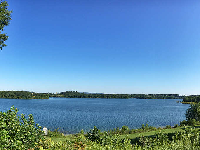 Lake Marburg stretches out like nature's own infinity pool, its blue waters perfectly mirroring Pennsylvania's endless summer sky.