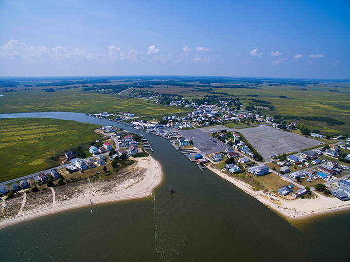 The meeting point of river and bay creates this postcard-perfect peninsula. From up here, you can almost hear the seagulls negotiating fishing rights.
