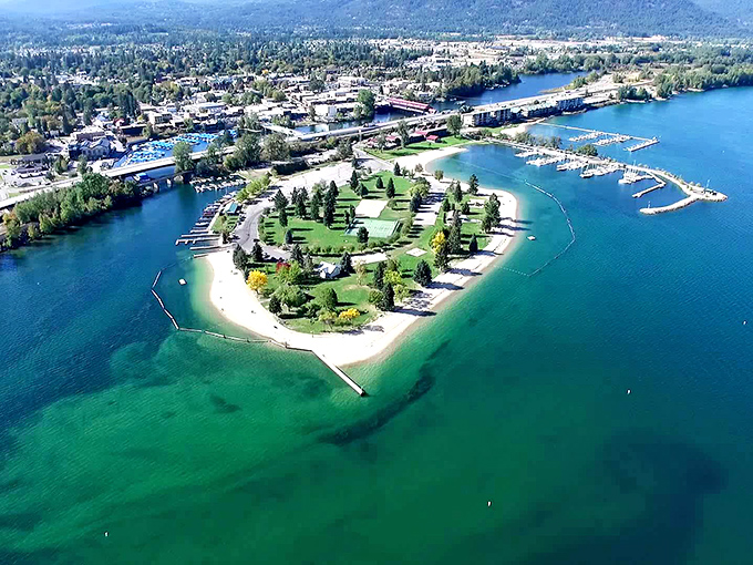 City Beach Park in Sandpoint offers a perfect circular oasis where emerald waters meet manicured greenery. Mother Nature showing off her landscaping skills at their finest.