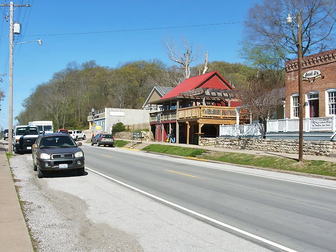 Main Street Grafton welcomes visitors with its unpretentious charm, where small-town America thrives beneath the watchful gaze of limestone bluffs.