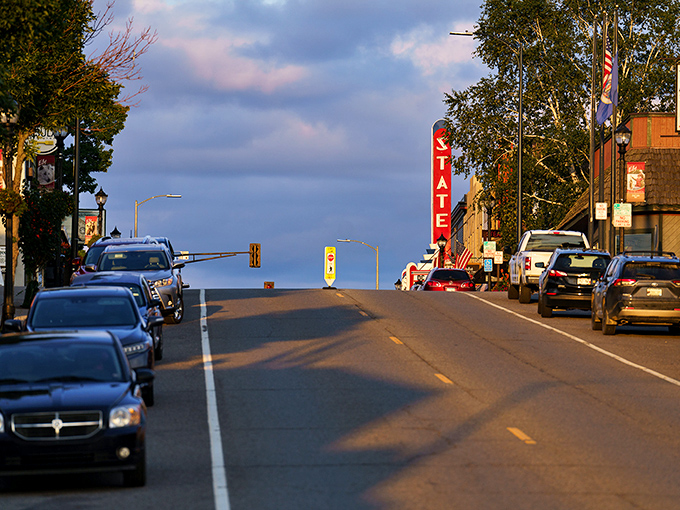 Ely's main street stretches toward the horizon like an invitation to slow down. The iconic State Theater sign stands sentinel over a town where adventure begins.