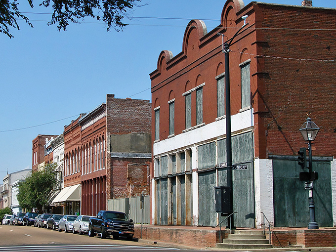 Historic brick buildings line Natchez's streets like architectural time capsules, offering a glimpse into the town's storied past while housing modern treasures.