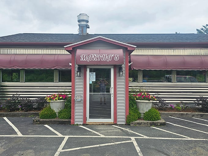 Martha's classic diner exterior beckons with its burgundy awnings and flower pots, promising comfort food and conversation in equal measure.