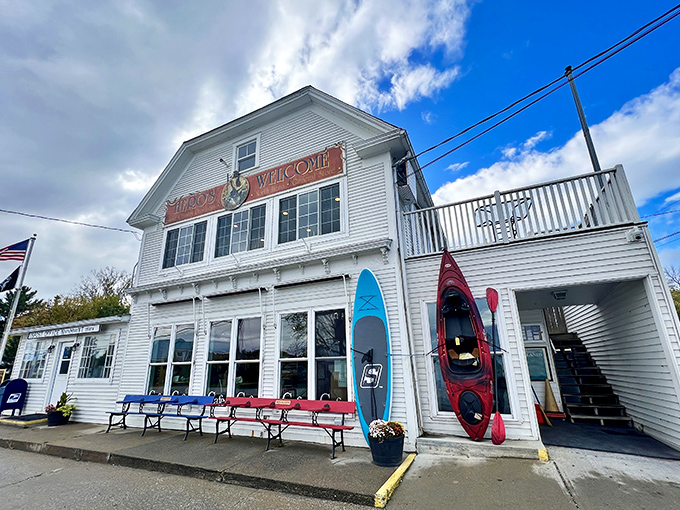 The classic white clapboard facade of Hero's Welcome stands proudly against Vermont's blue sky, a beacon of sandwich salvation on Lake Champlain's shores.