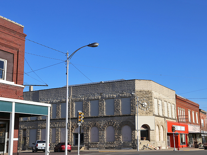 Historic limestone buildings stand sentinel in downtown Belleville, where architectural character meets small-town charm under impossibly blue Kansas skies.