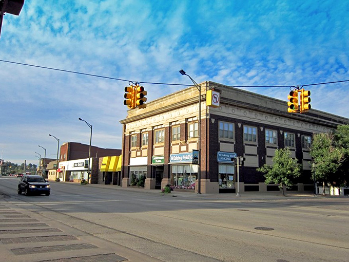 Historic buildings line Iron Mountain's main street, where brick facades tell stories of the town's mining heyday and small businesses still thrive without a chain store in sight.