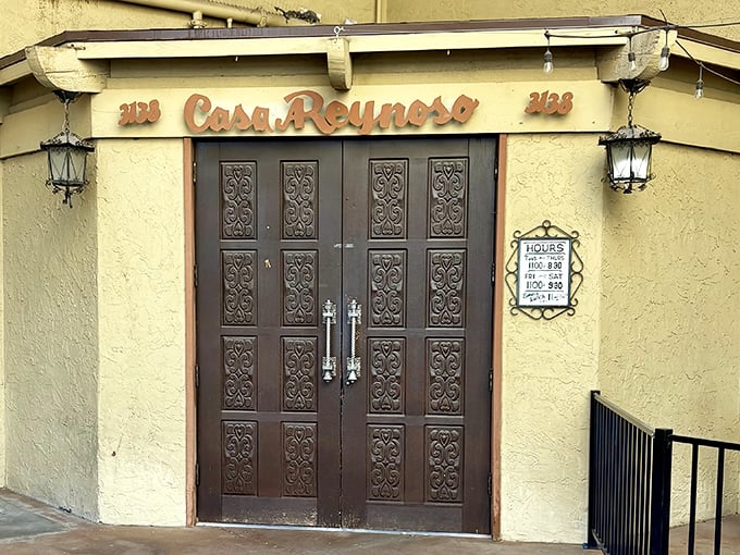 Those ornate wooden doors aren't just an entrance &ndash; they're a portal to flavor country where green chili reigns supreme.
