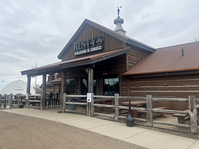 The rustic wooden exterior of Rusty's stands like a prairie sentinel, promising hearty meals and warm hospitality behind those weathered doors.