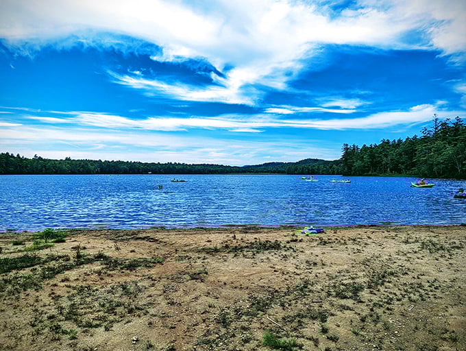 Otter Lake stretches out like nature's welcome mat, where kayakers drift under a sky so blue it looks Photoshopped. New Hampshire showing off again.