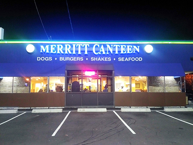 After dark, Merritt Canteen's illuminated sign serves as a beacon for late-night comfort food cravings in Bridgeport.