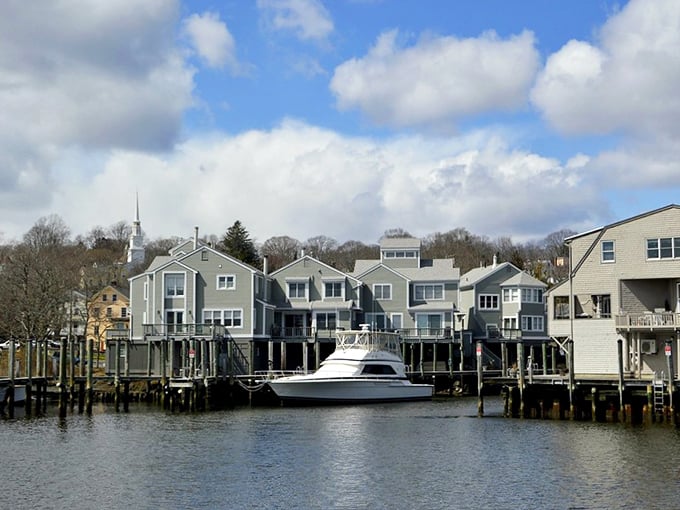 Waterfront homes with private docks line Mystic's shoreline, offering residents and visitors alike stunning views of the peaceful river.