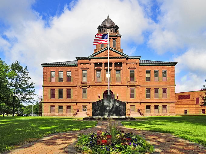 The Langlade County Courthouse stands proud like a brick sentinel, its dome reaching skyward as if keeping watch over the community below.