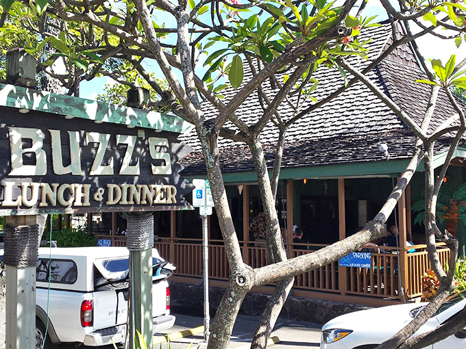 Buzz's iconic exterior welcomes you like an old friend, with mature trees providing natural shade for this beloved Kailua institution.