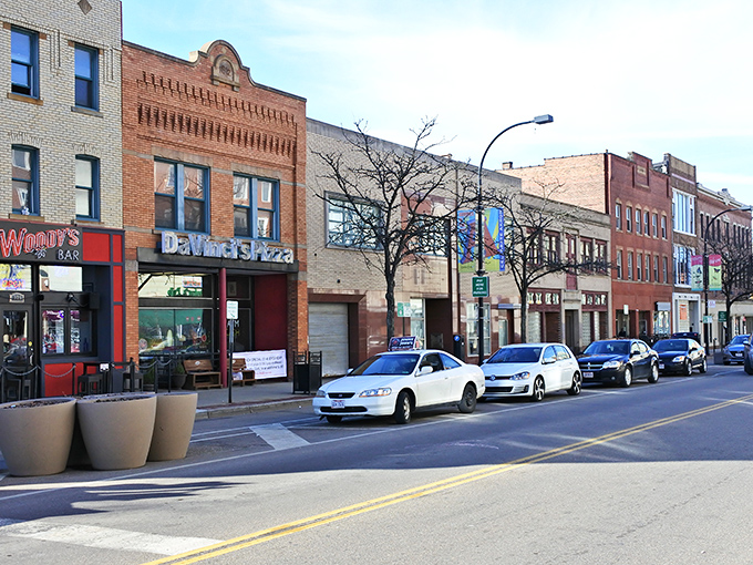 Highland Square's bustling streetscape offers a slice of neighborhood charm where local eateries and shops thrive without big-city price tags.