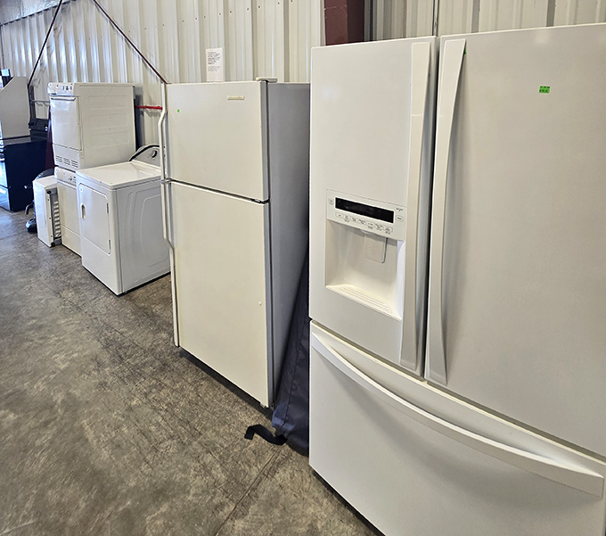 The appliance lineup: where perfectly good refrigerators wait for their second chance at keeping your leftovers cold and your beverages frosty.