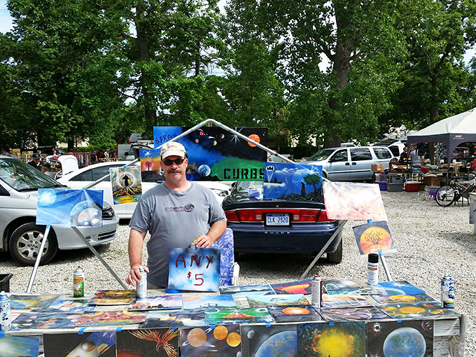 Cosmic art at earthly prices! This vendor's galactic paintings offer $5 trips to other dimensions without leaving Michigan's atmosphere.