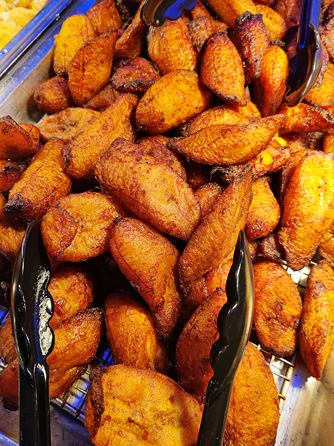 Fried plantains glistening with caramelized sweetness. These golden beauties are the unsung heroes of the buffet circuit.