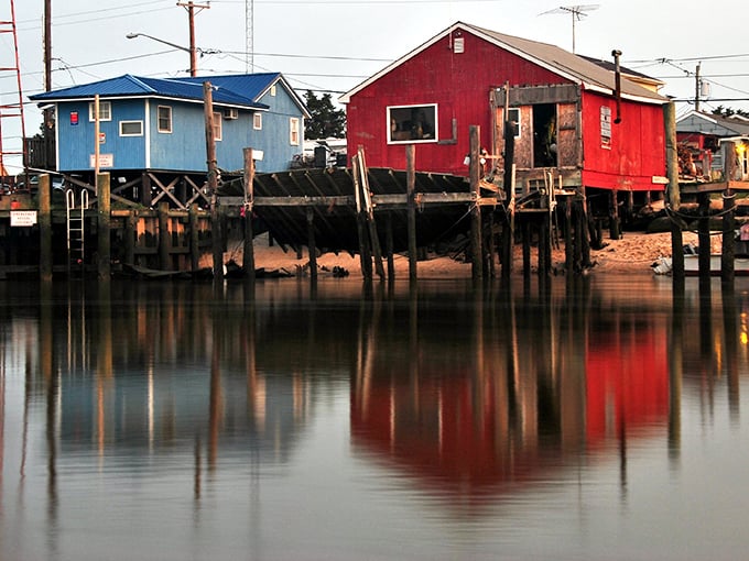 Colorful fishing shacks reflect in still waters like an impressionist painting. Monet would have set up his easel here and never left.