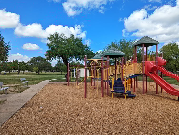 Bill Schupp Park's playground stands ready for the universal childhood joy of sliding, climbing, and the inevitable "Watch me!" moments.