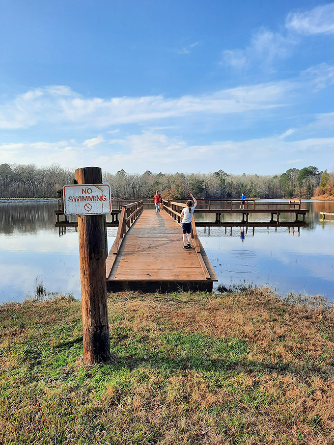 The fishing pier stretches into Lake Lee like an invitation &ndash; even the "No Swimming" sign can't dampen the excitement of exploration.