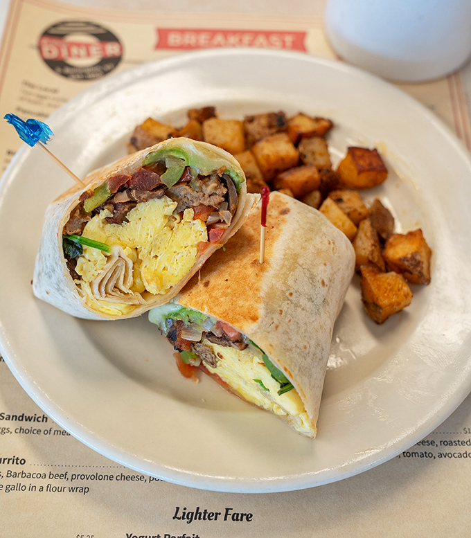 Breakfast burrito perfection: Where scrambled eggs, savory fillings, and a warm tortilla come together in holy matrimony, with home fries playing best man.