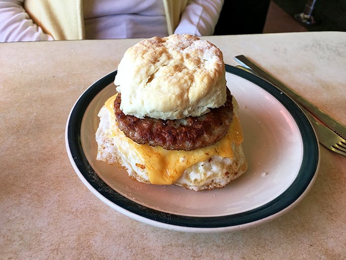 The breakfast sandwich that launched a thousand workdays—a buttery biscuit embracing eggs, sausage, and cheese with morning enthusiasm.