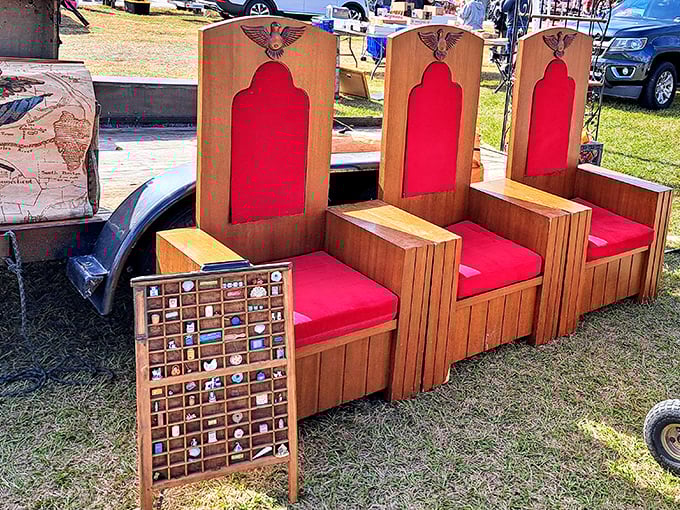 These regal wooden chairs with eagle emblems and red cushions aren't just seating&mdash;they're thrones waiting for the right kingdom.