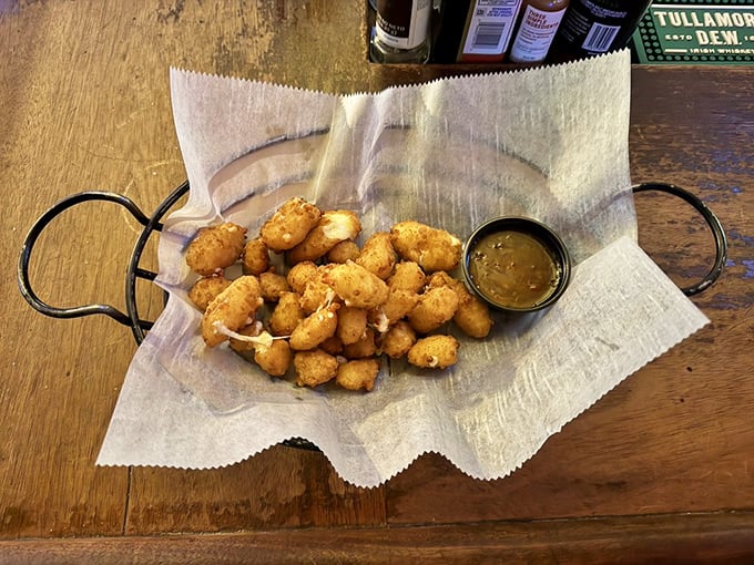 These golden cheese curds look like they're having more fun than anyone in the room &ndash; crispy, gooey, and ready for their dipping sauce companion.