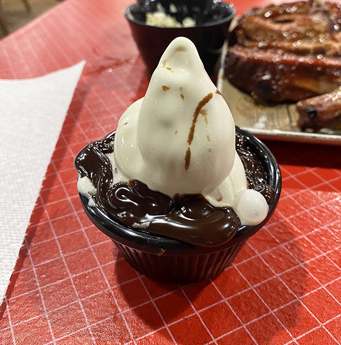 This chocolate brownie sundae isn't dessert—it's therapy in a cup with a soft-serve diploma and hot fudge credentials.