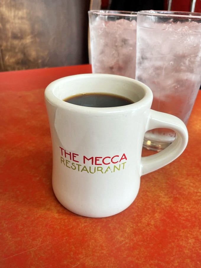 The official morning handshake at Mecca&mdash;a sturdy mug of coffee that promises to turn "not a morning person" into "ready to face the day."