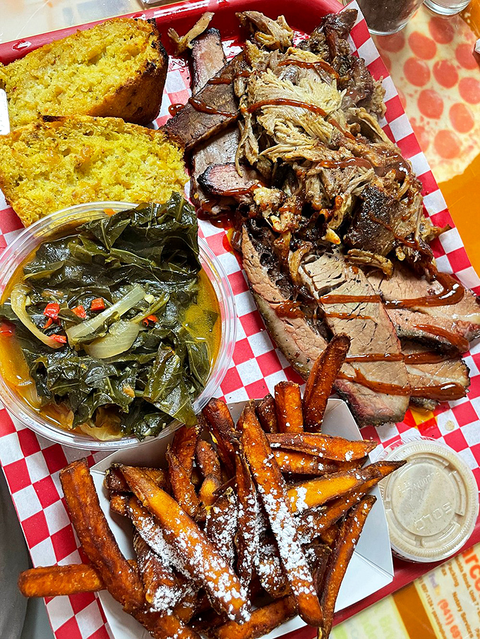 A barbecue sampler that covers all the bases: smoky meat, vibrant greens, golden cornbread, and sweet potato fries dusted with powdered sugar&mdash;because why not?