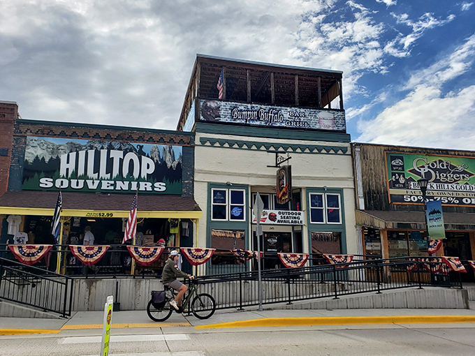 Hilltop Souvenirs and Bumpin' Buffalo Bar share real estate on a street where Americana thrives in every storefront.