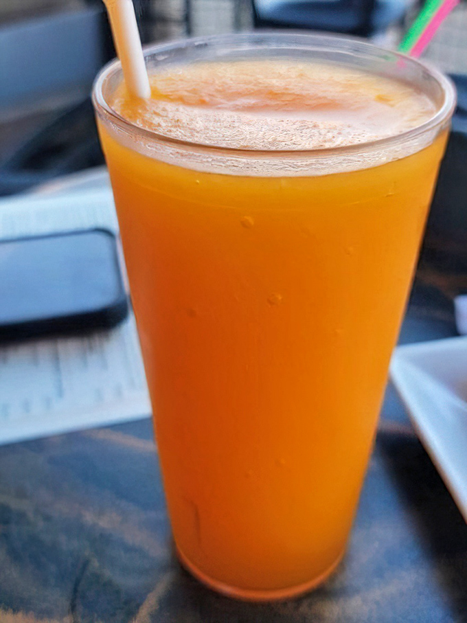 That orange glow isn't just from food coloring&mdash;it's the sunset of beverages, promising refreshment with a side of vitamin C and vacation vibes.