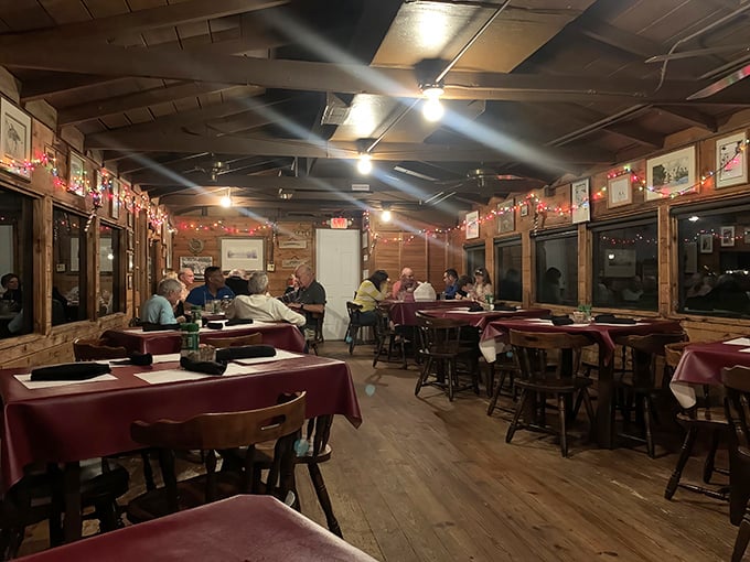 Evening at Cap's Place transforms the rustic dining room into an intimate gathering spot where strangers become friends over great food.