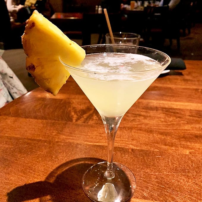 A martini garnished with fresh pineapple&mdash;because sometimes your drink deserves to wear a fancy hat. Crystal clear and perfectly chilled.
